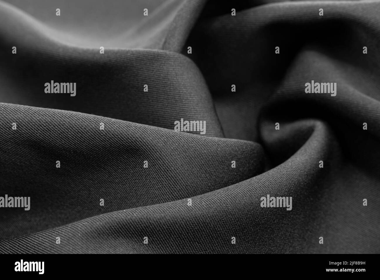 A piece of black cloth. Fabric texture for background and design works ...