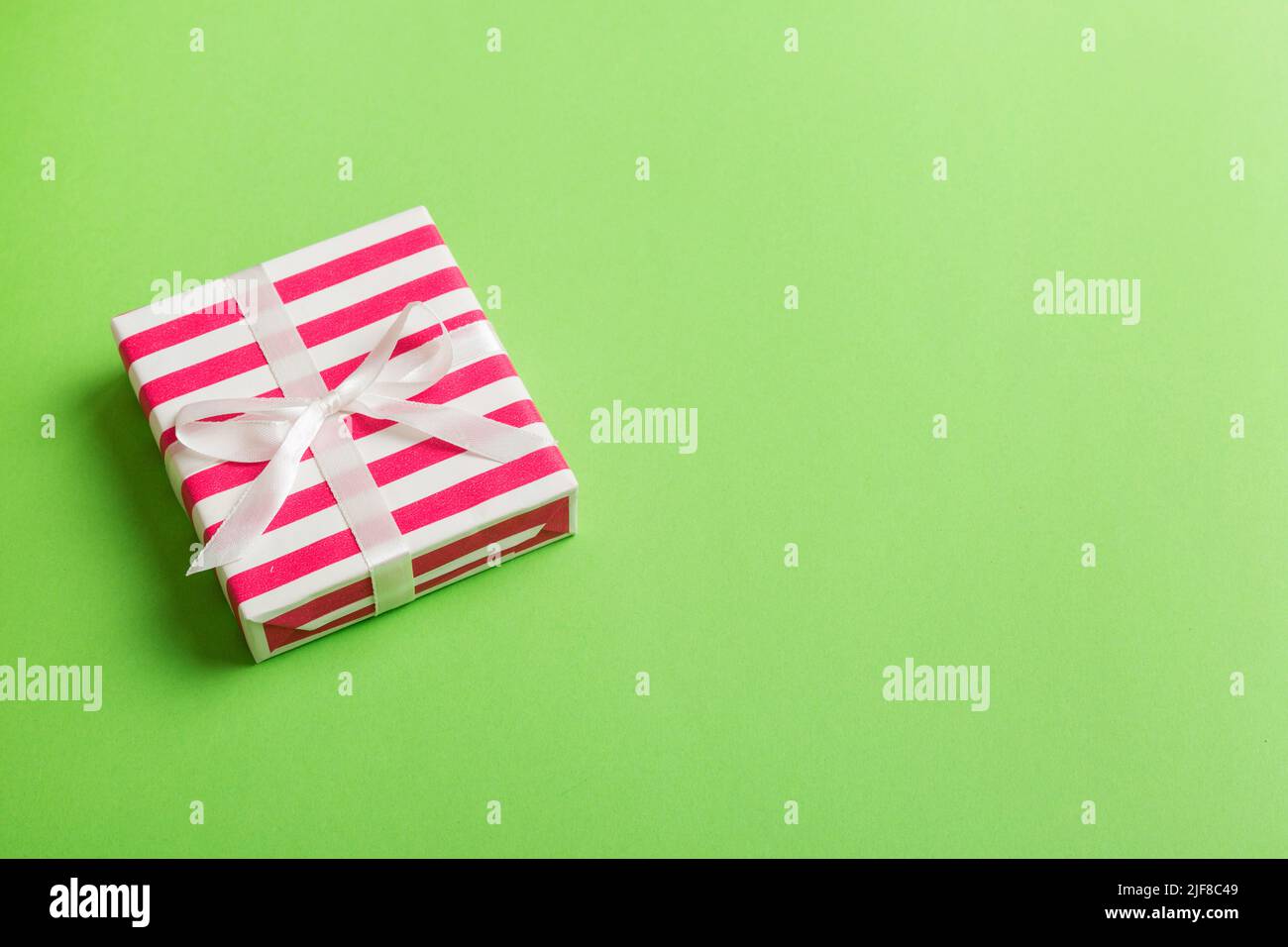 wrapped Christmas or other holiday handmade gift box in color paper ...