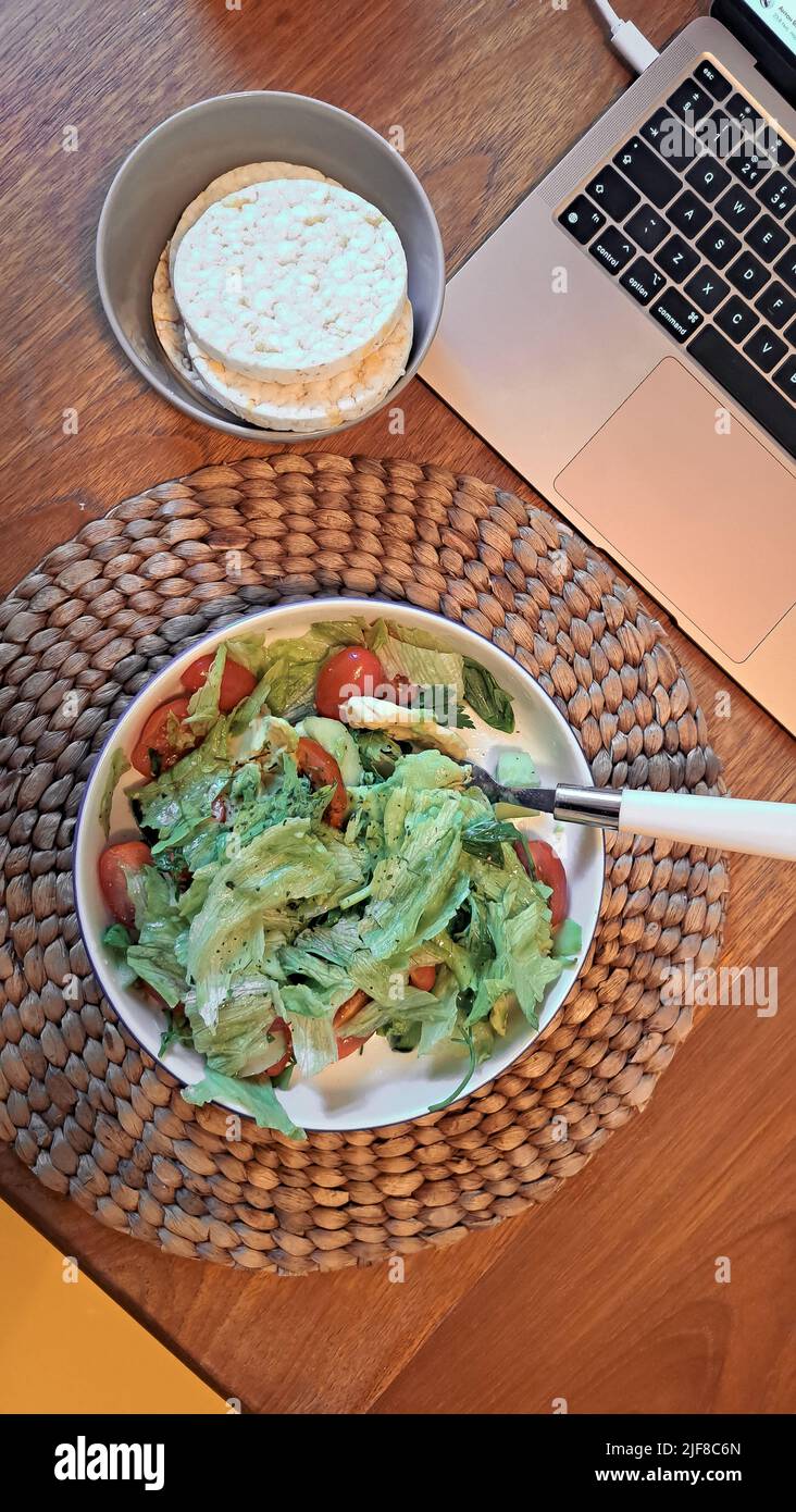 Green salad with tomatoes and lettuce, supper and watching movie on ...