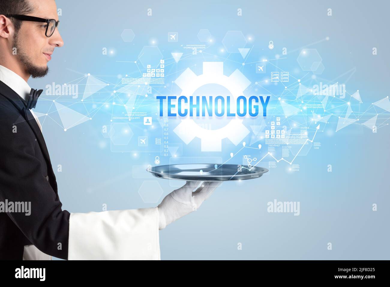 Waiter serving new technology concept Stock Photo - Alamy