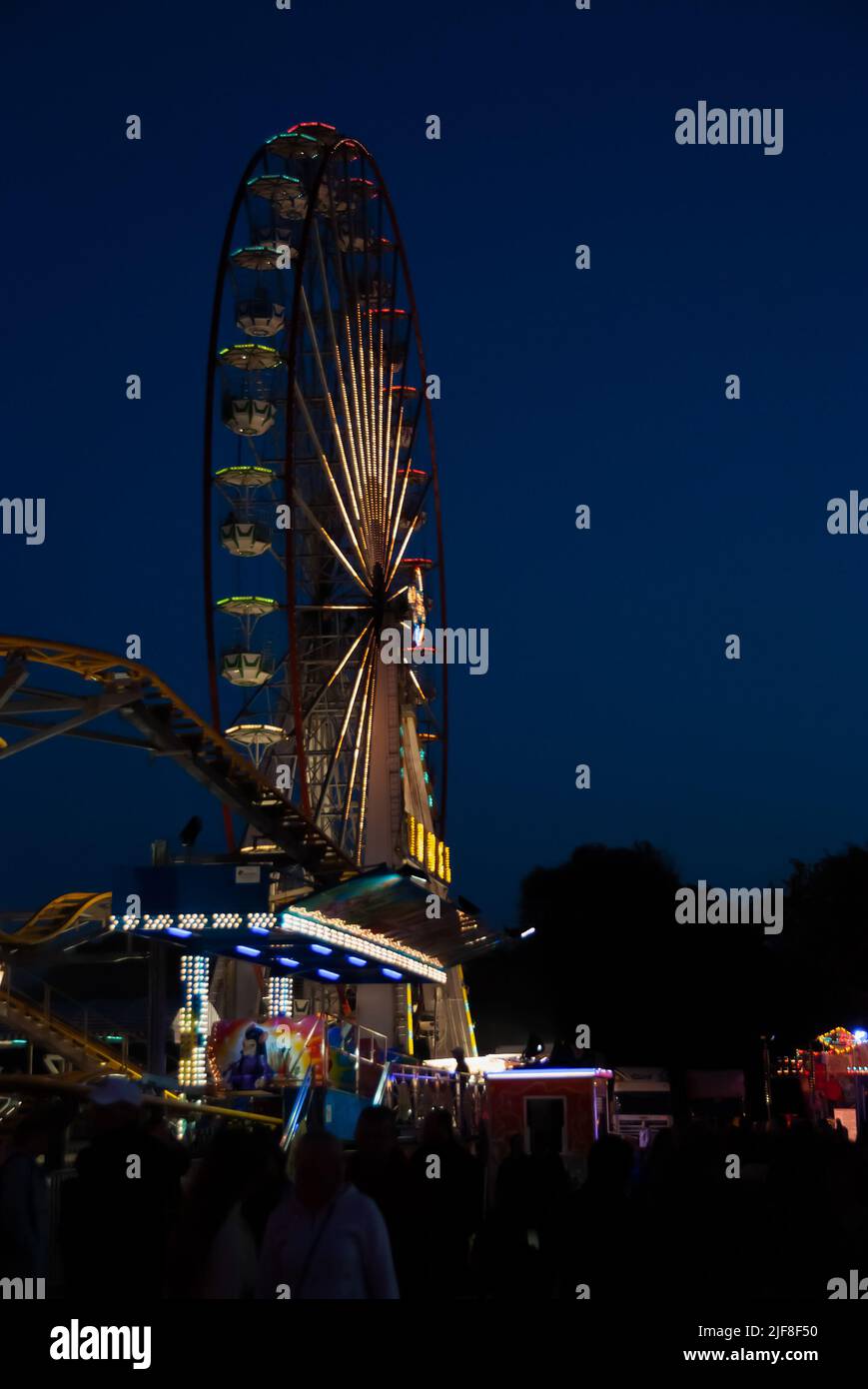 Fairground rides at night Stock Photo - Alamy