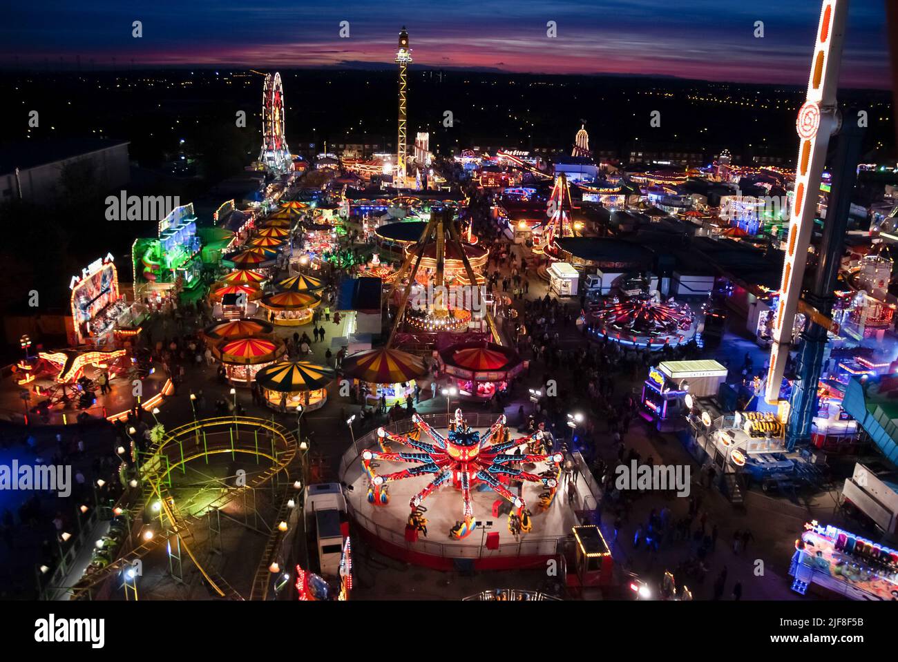Fairground rides at night Stock Photo - Alamy