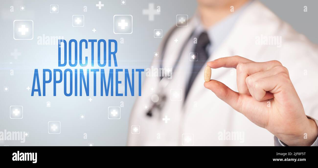 Doctor gives pill patient close hi-res stock photography and images - Alamy