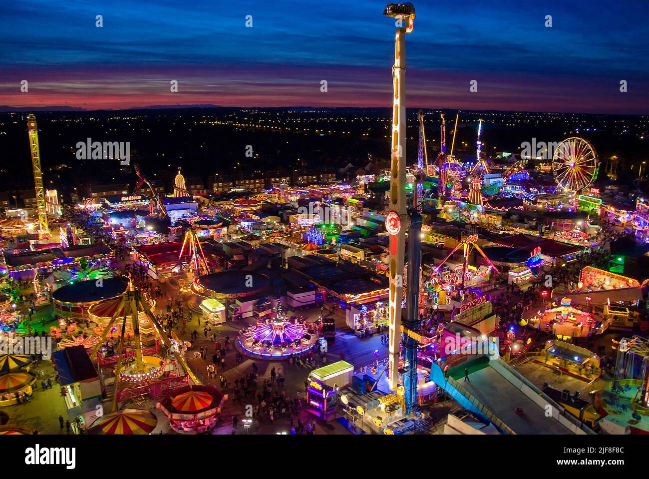 Fairground rides at night Stock Photo - Alamy