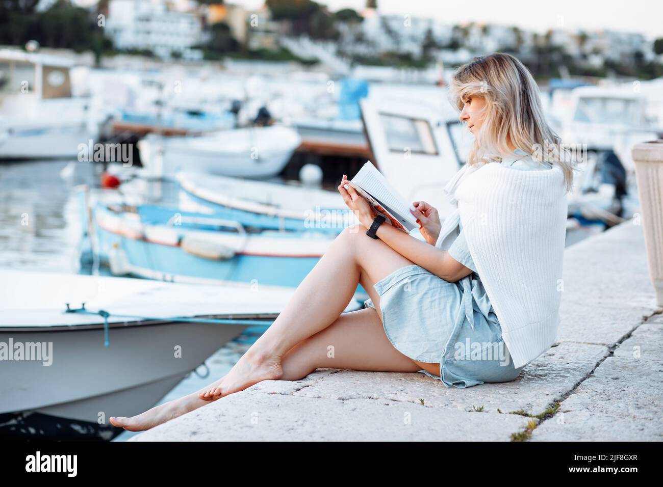 Time of rest and relaxation. Happy charming young woman enjoys fresh ...