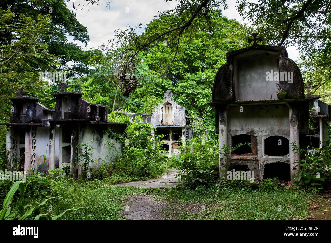 Abandoned open graves in the cemetery of the old town of Armero ...