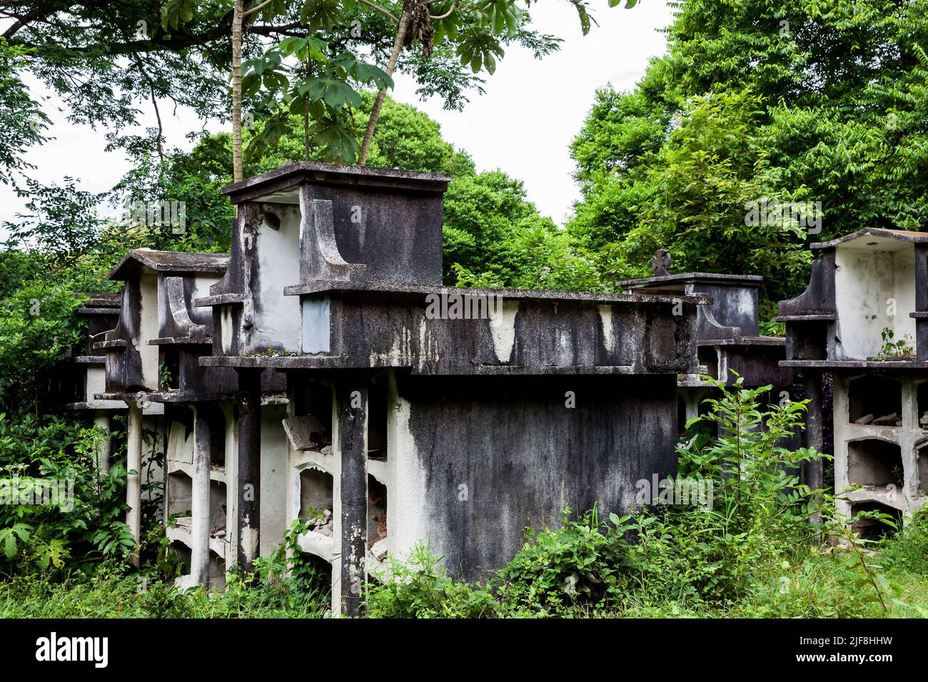 Abandoned open graves in the cemetery of the old town of Armero ...
