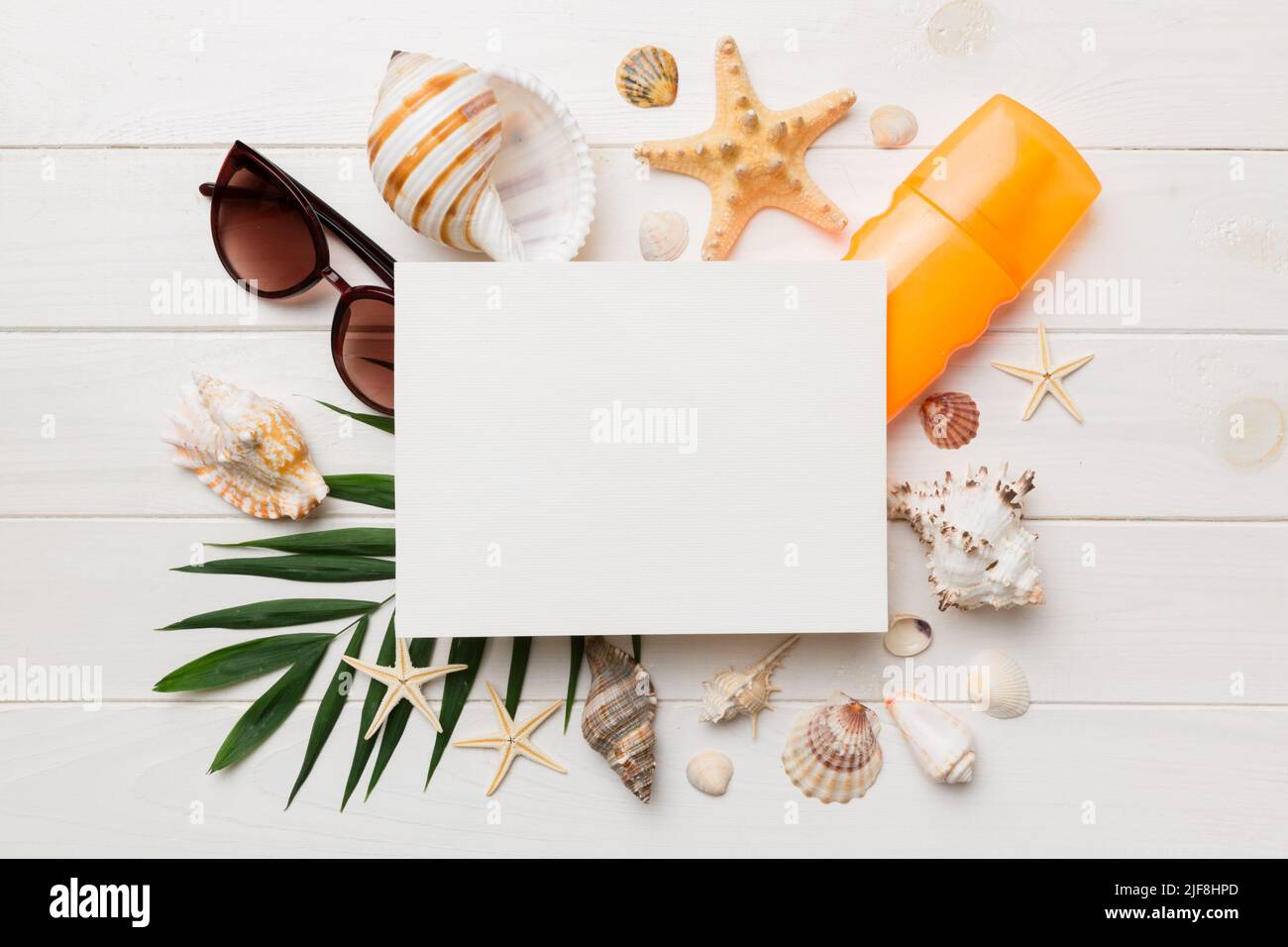 Summer time concept with blank greeting card and blank white paper on ...