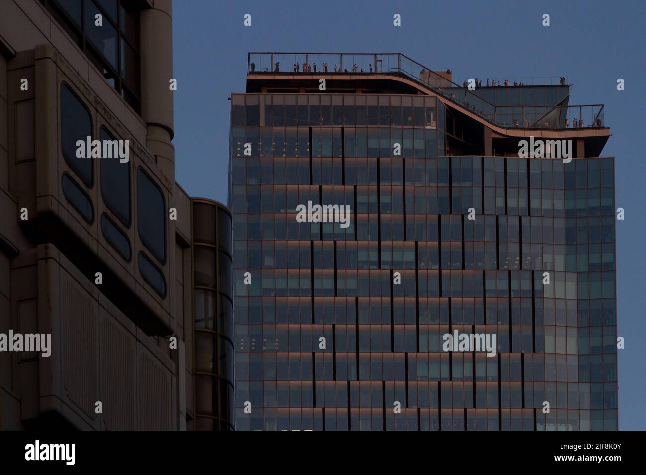People on the the rooftop observation deck of the Shibuya Stream tower ...
