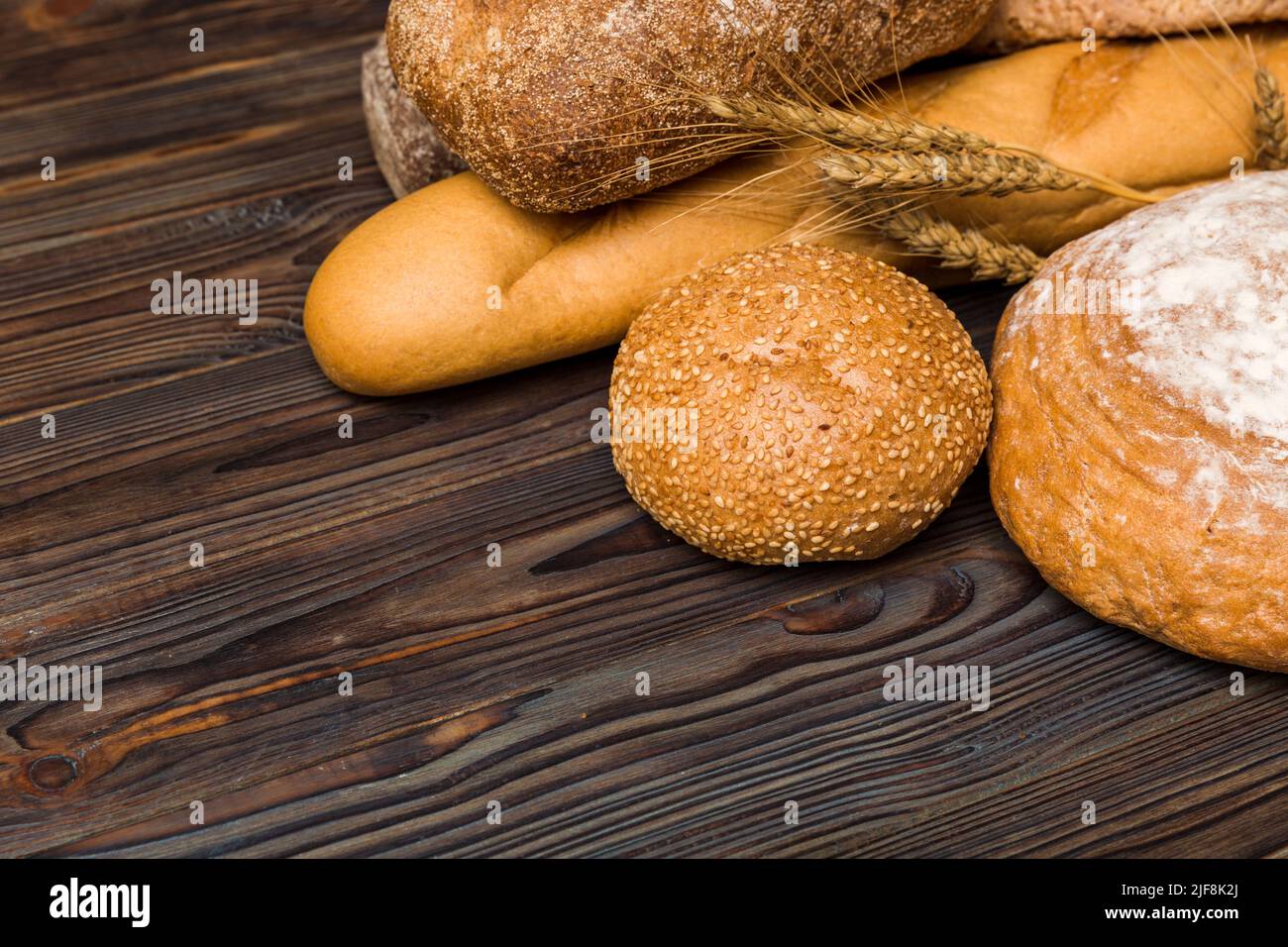 Homemade natural breads. Different kinds of fresh bread as background ...