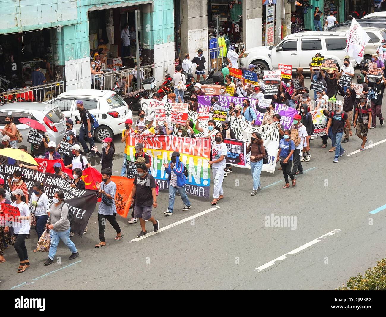 Manila, Philippines. 30th June, 2022. Protesters holding banners march ...