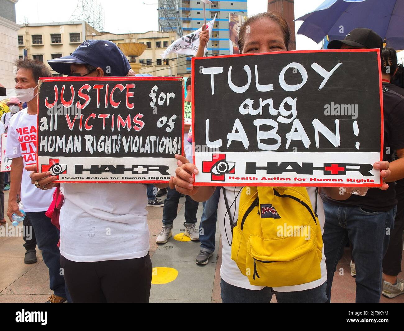 Women protesters holding their placards calling for justice for all ...