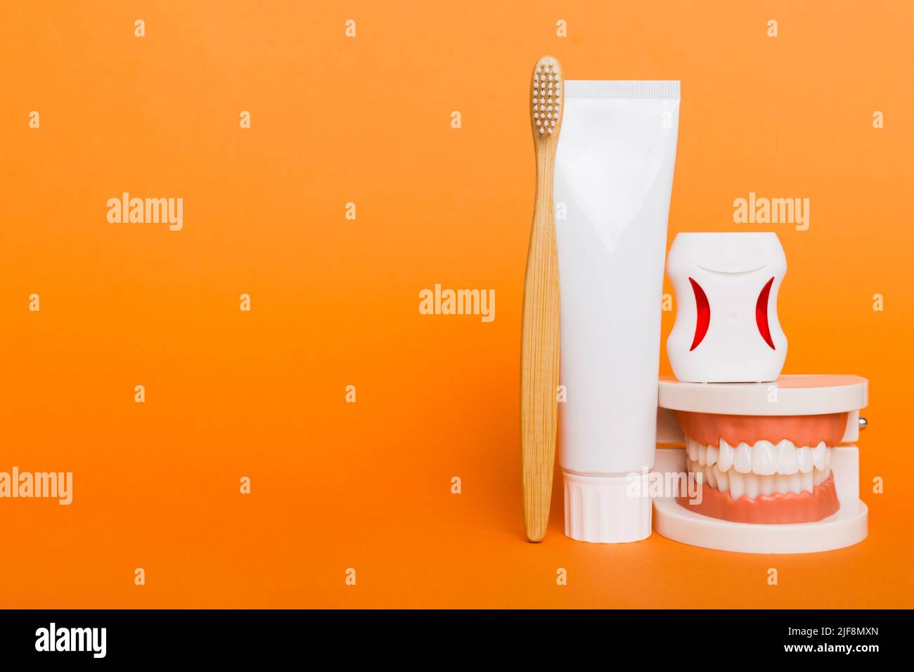 Mouthwash and other oral hygiene products on colored table top view ...