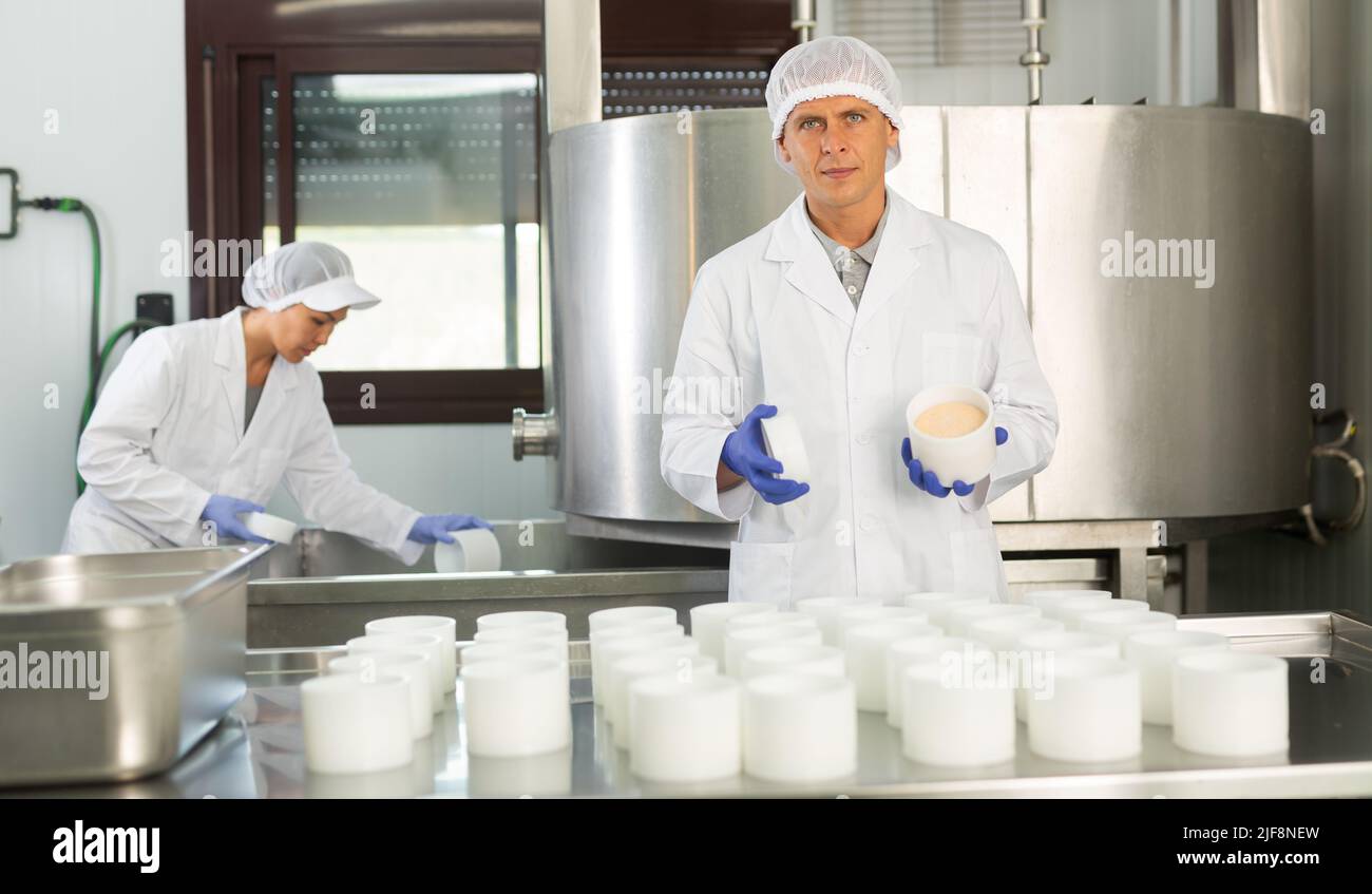 Young man cheese wheel hi-res stock photography and images - Alamy