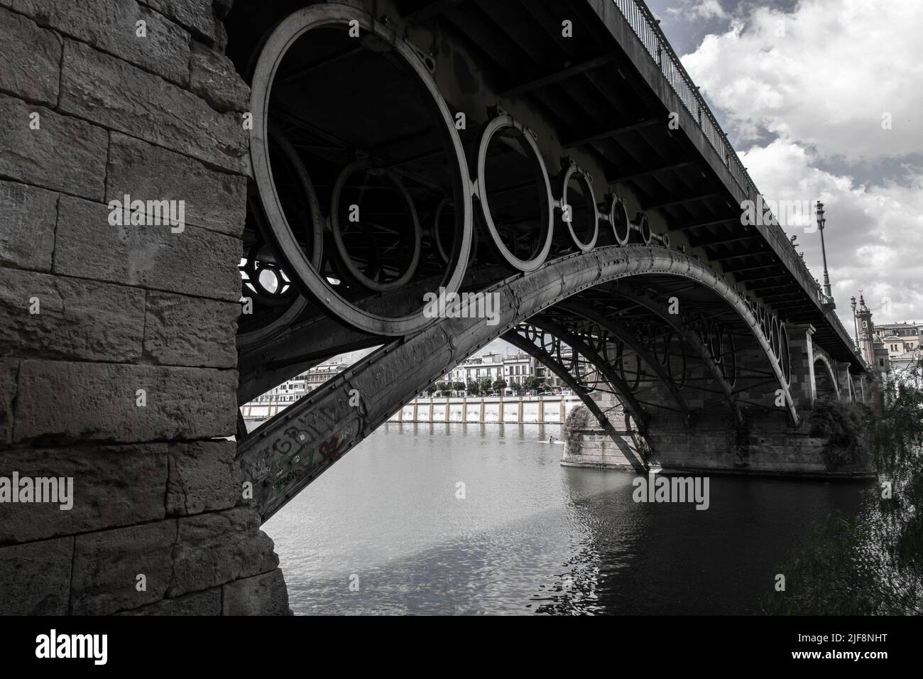 View on the base of the Triana bridge (Puente de Triana) at ...