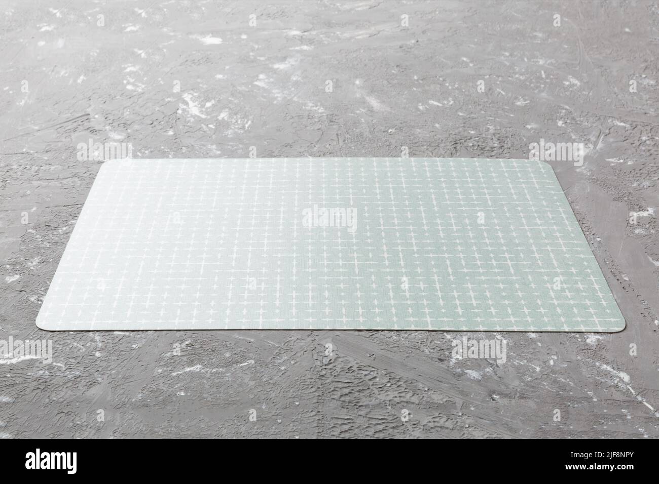 Perspective view of grey tablecloth for food on cement background ...