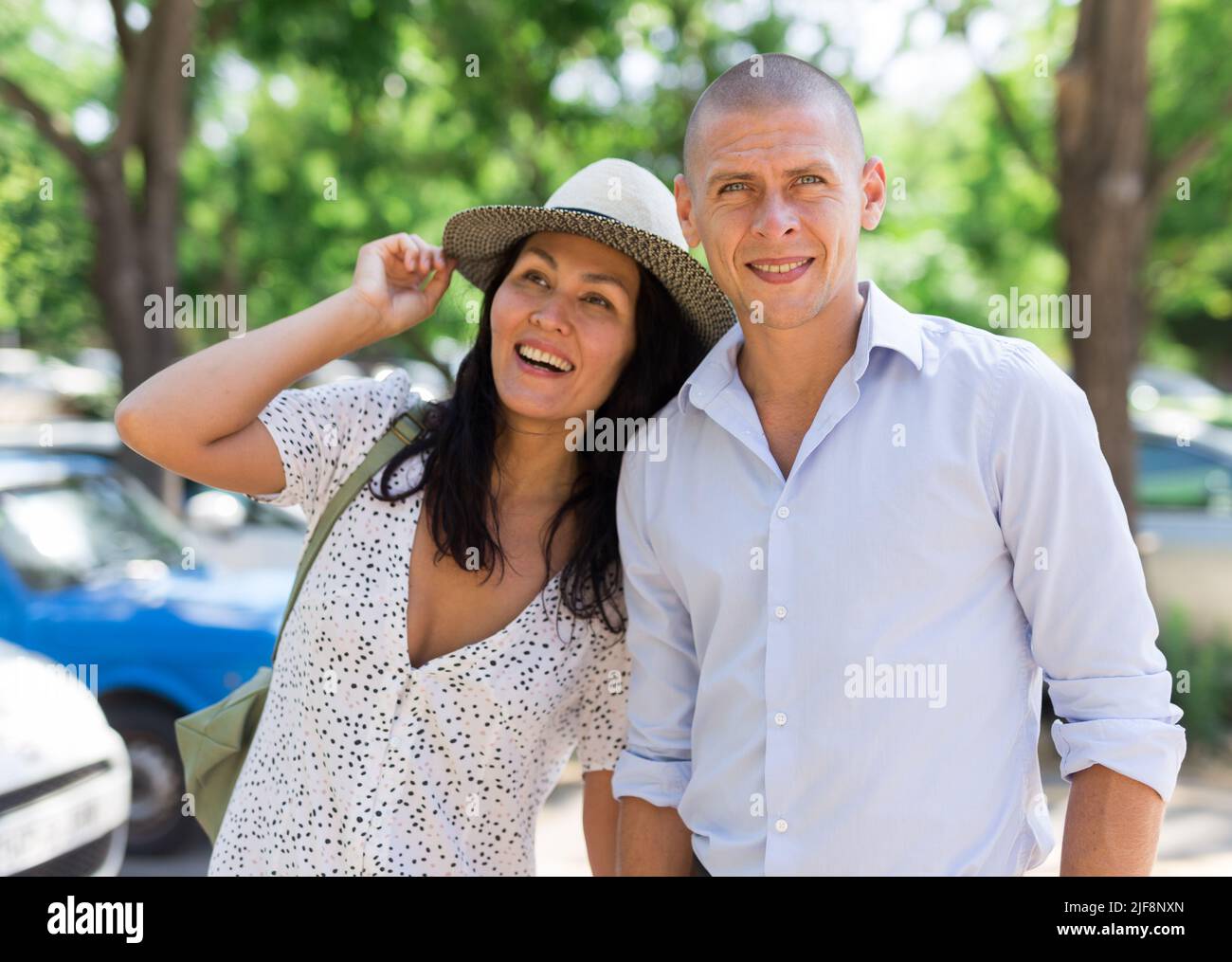 Adult man and woman walking together Stock Photo - Alamy
