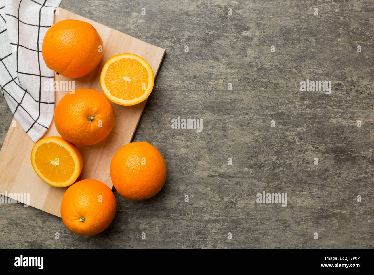 Fresh ripe oranges on cutting board on table. Top view Flat lay Stock ...