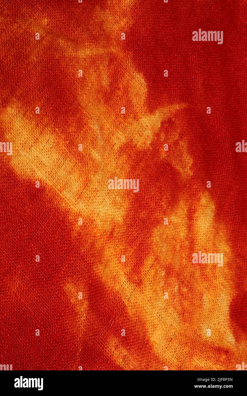 Yellow red textile design made with chlorine close up modern background ...