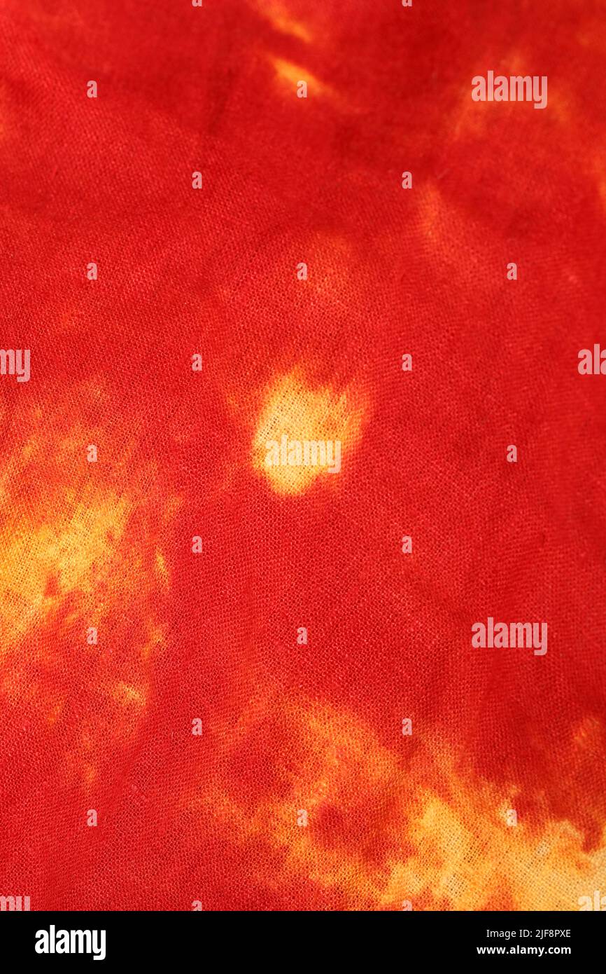 Yellow red textile design made with chlorine close up modern background ...