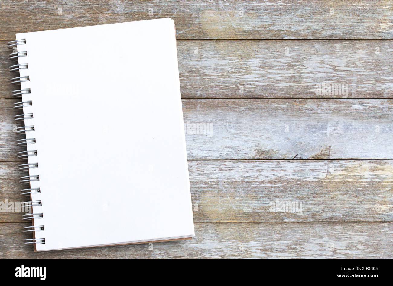 Top view with blank notebooks on wood table in office workplace. space ...