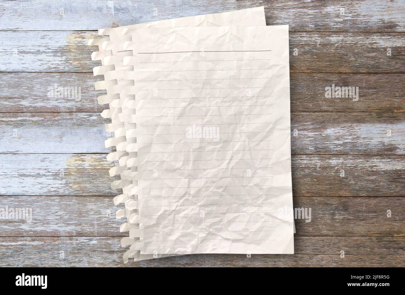 White paper on old wooden table background with copy space for any ...