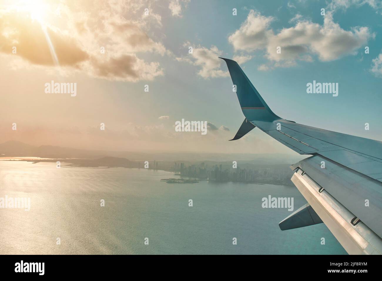 View from the airplane window on a beautiful sunset and clouds of ...