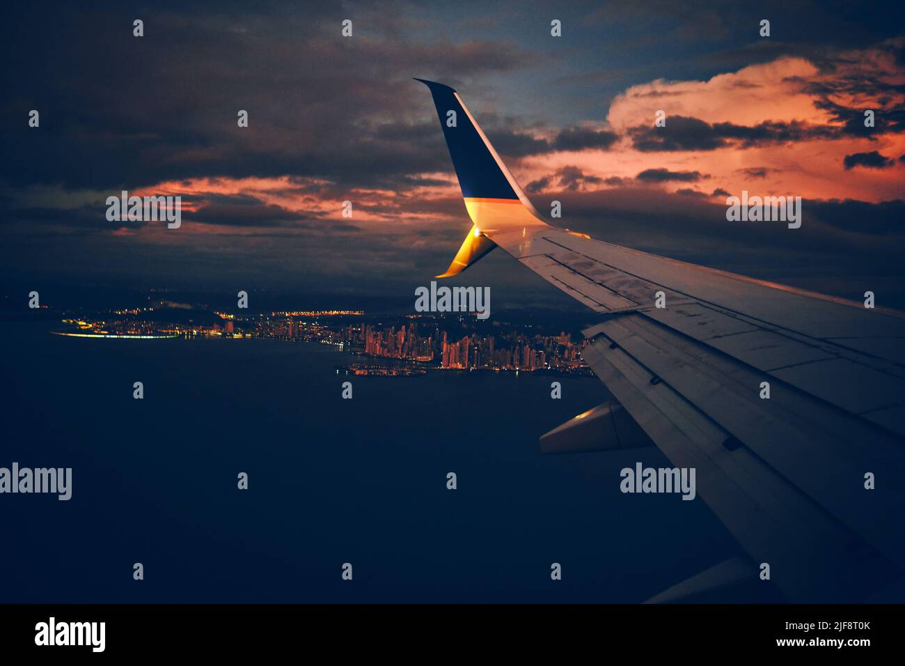 View from the airplane window on a beautiful sunset and clouds of ...