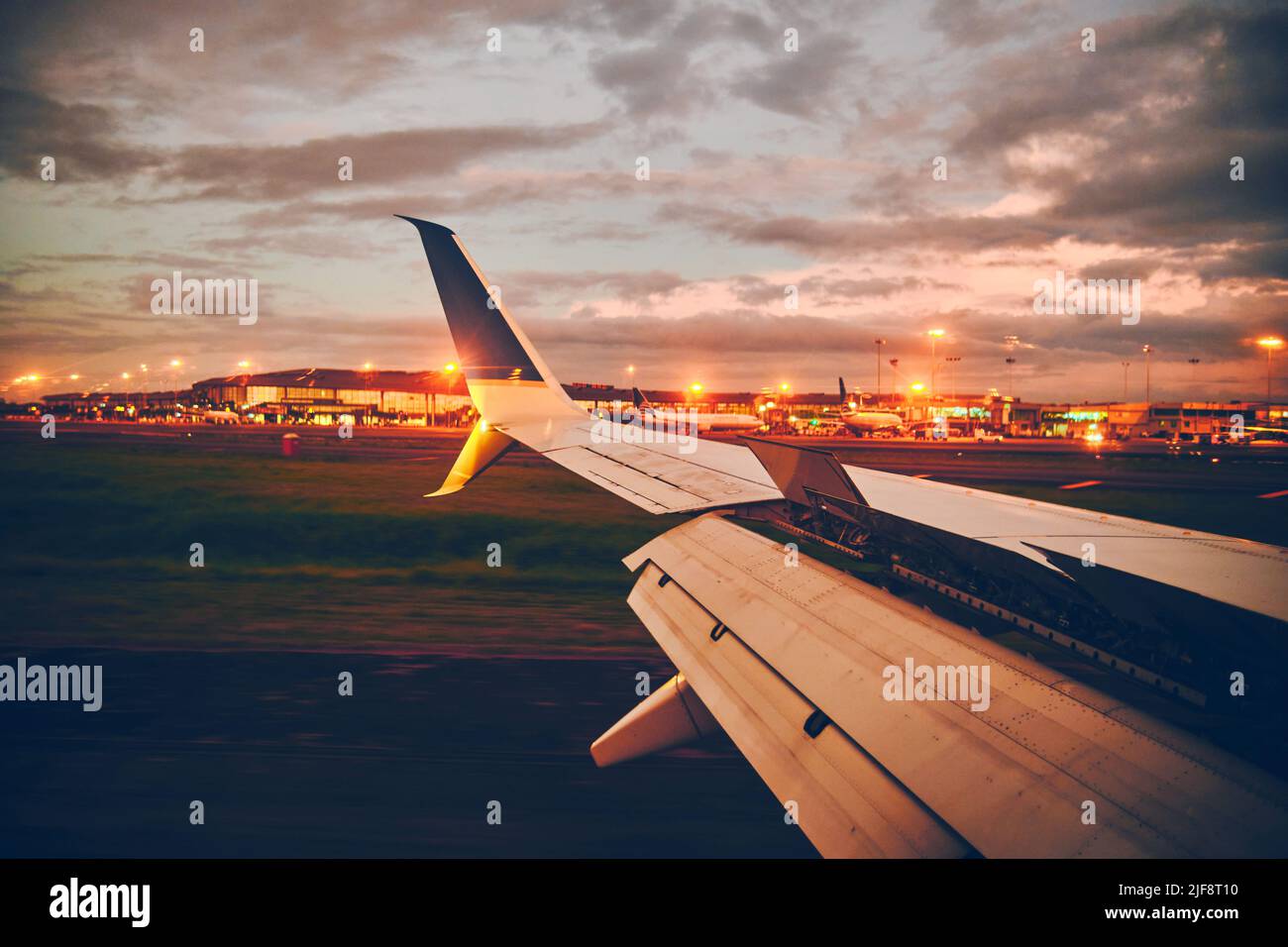 View from the airplane window on a beautiful sunset and clouds of ...