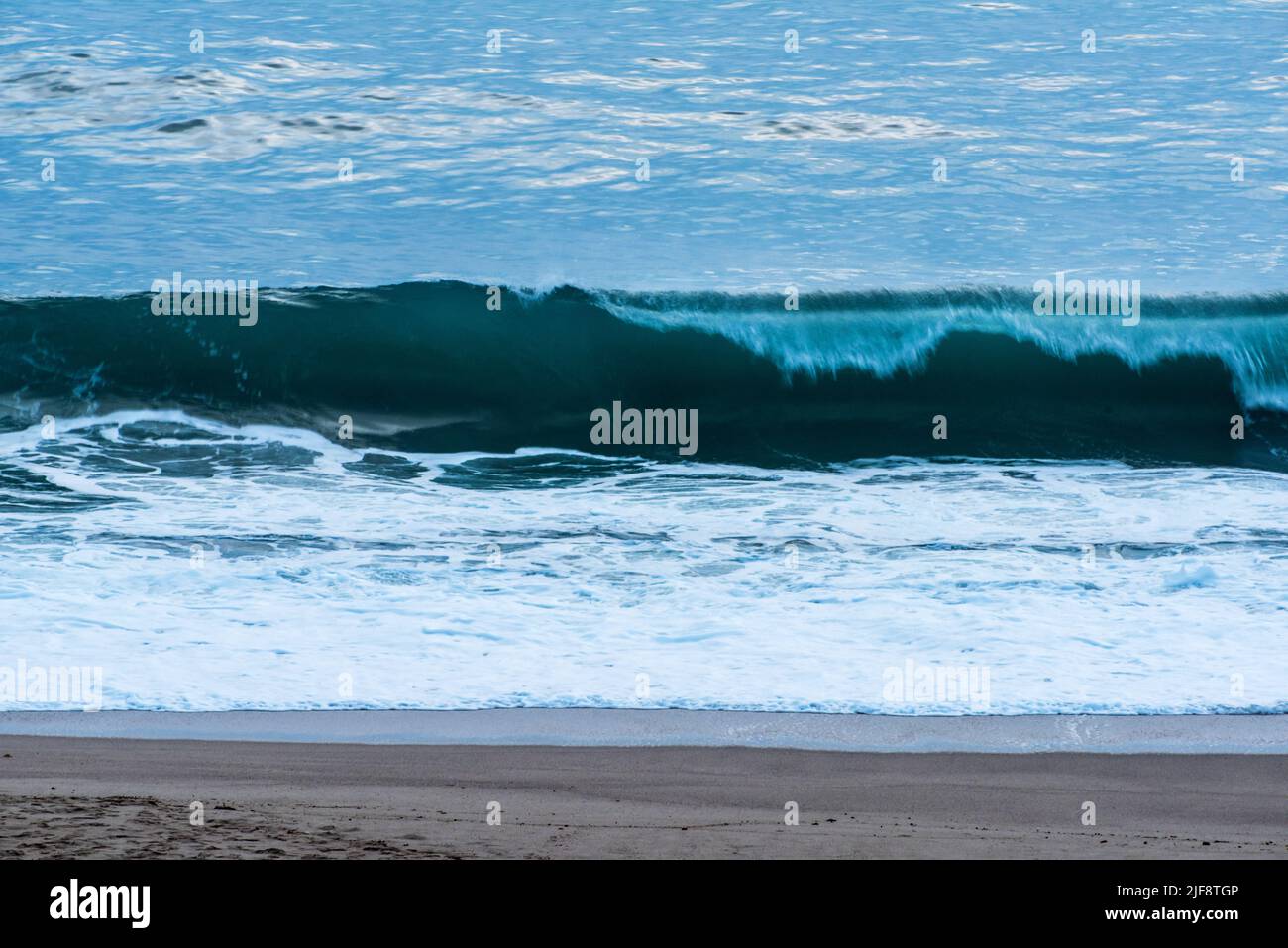 The big breaking waves during a strom at the beautiful summer sea shore ...