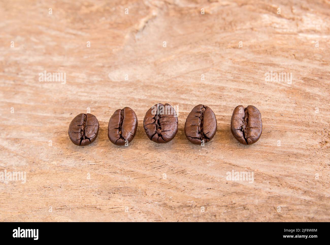 Coffee beans on wooden table background for any design Stock Photo - Alamy
