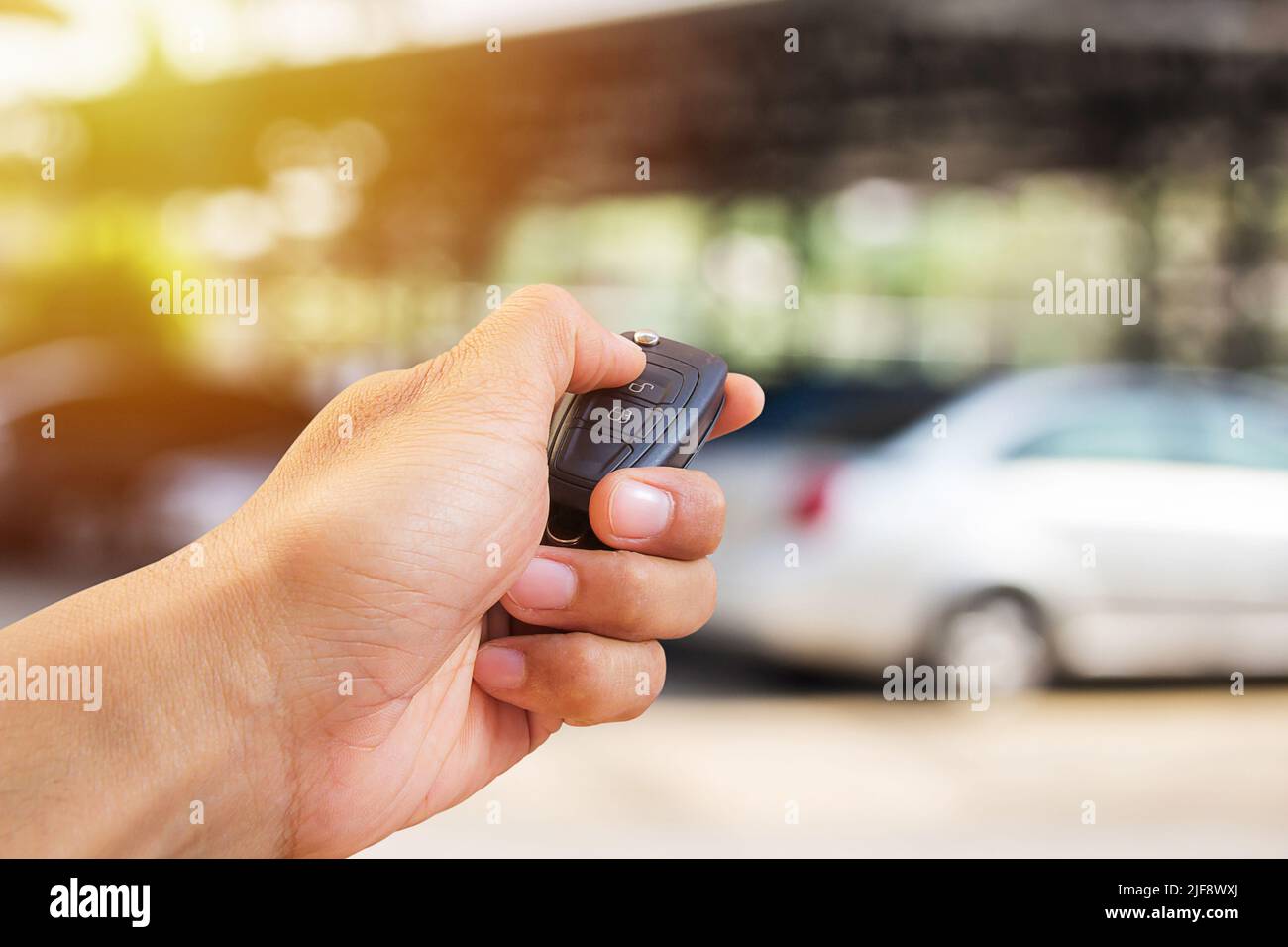 Men's hand presses on the remote control car alarm systems Stock Photo ...
