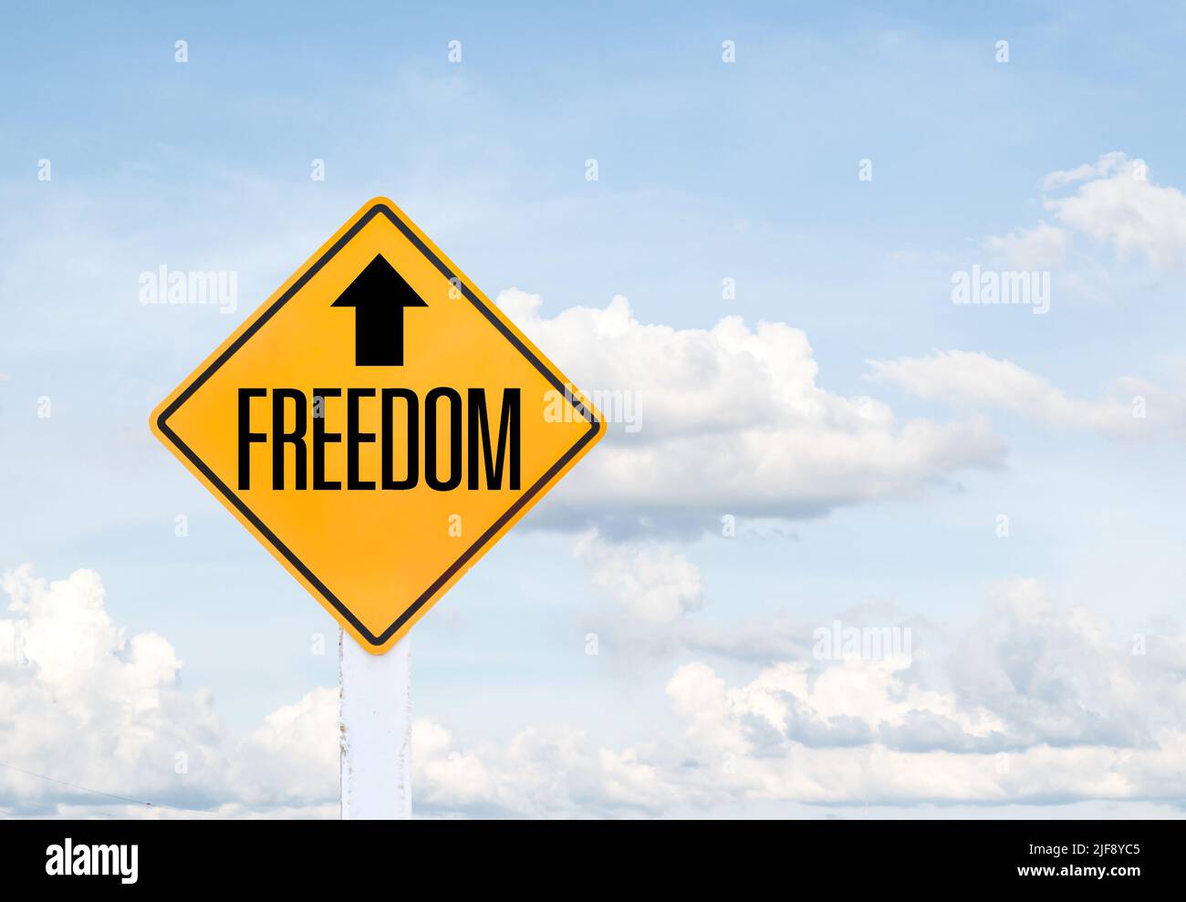 Yellow traffic sign text for freedom with blue sky background Stock ...