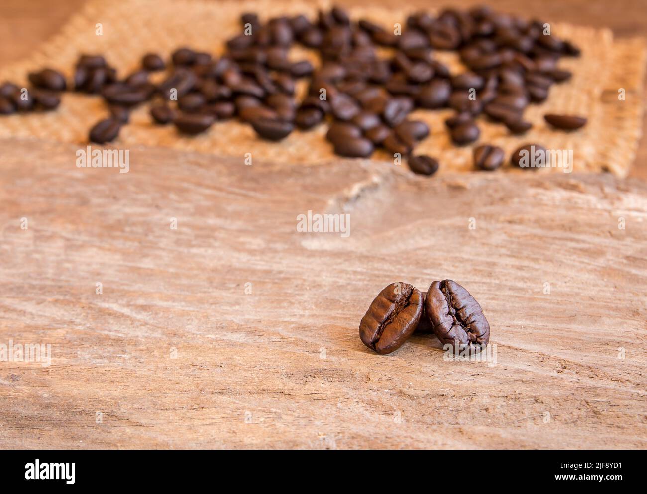 Coffee beans on wooden table background for any design Stock Photo - Alamy