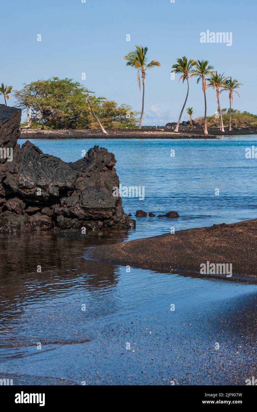 The beautiful blue waters and black lava shore of Kiholo Bay on the Big ...