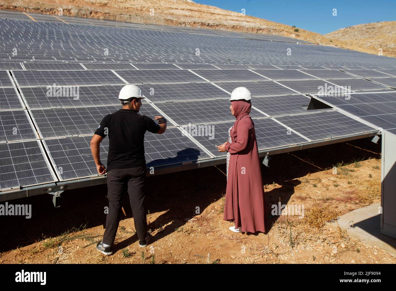 Jordan Valley, Palestine. 30th June, 2022. Palestinian engineers work ...