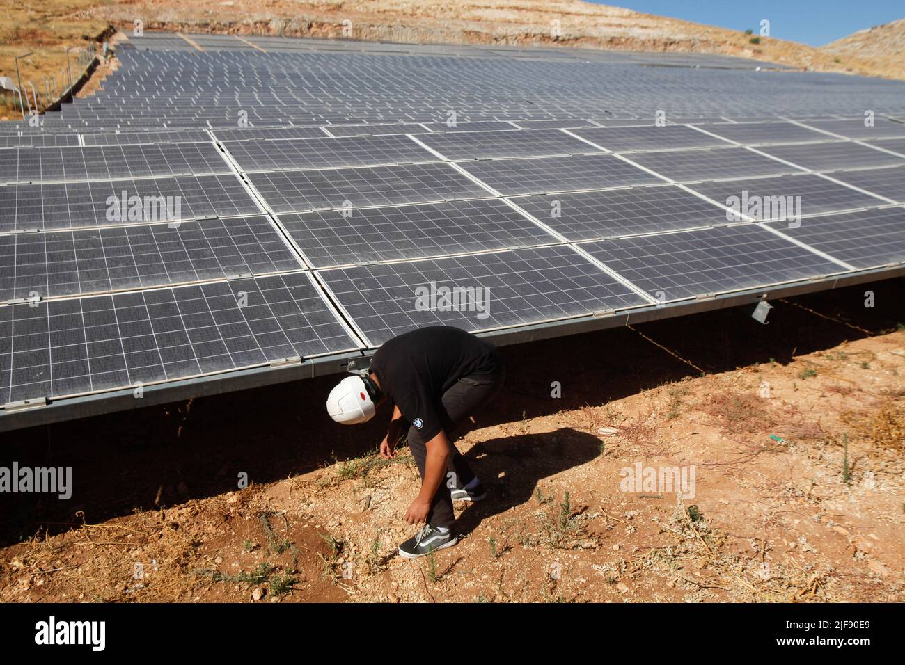 Jordan Valley, Palestine. 30th June, 2022. A Palestinian engineer works ...