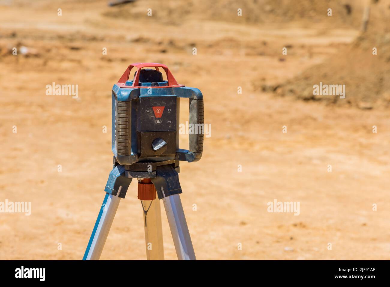 Construction site contractors use laser a trench for a concrete ...