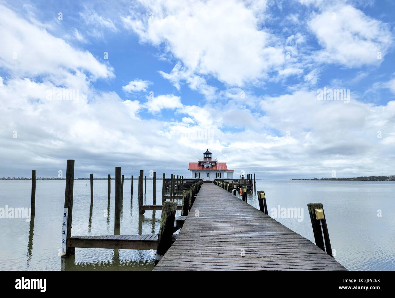 Roanoke Marshes Lighthouse in Shallowbag Bay under cloudy skies ...