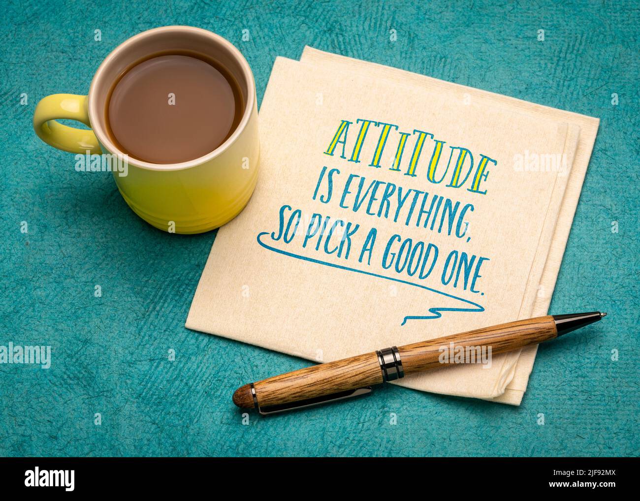 attitude is everything - motivational slogan on a napkin with a cup of ...