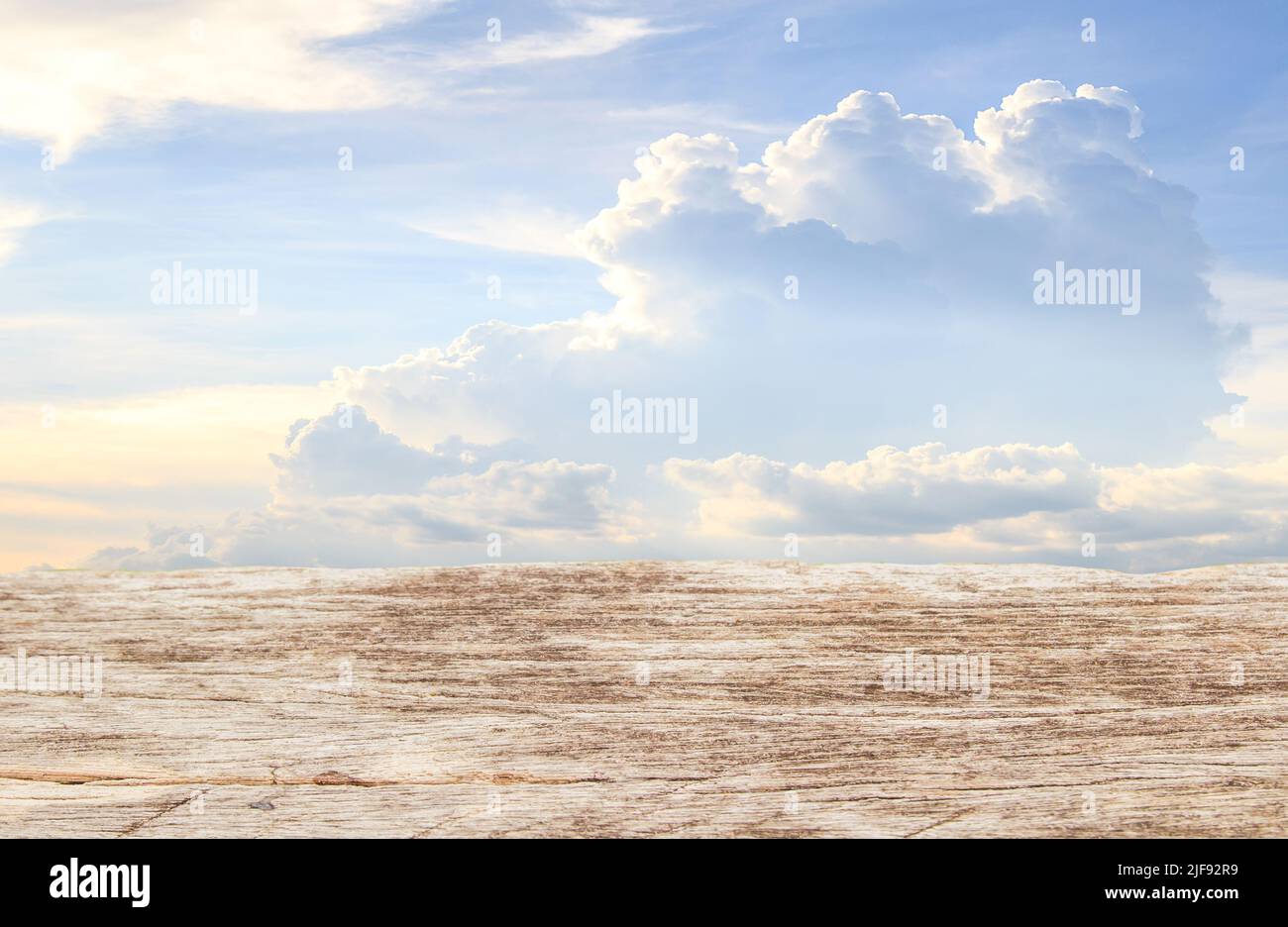 Wooden table with blurred blue sky background Stock Photo - Alamy