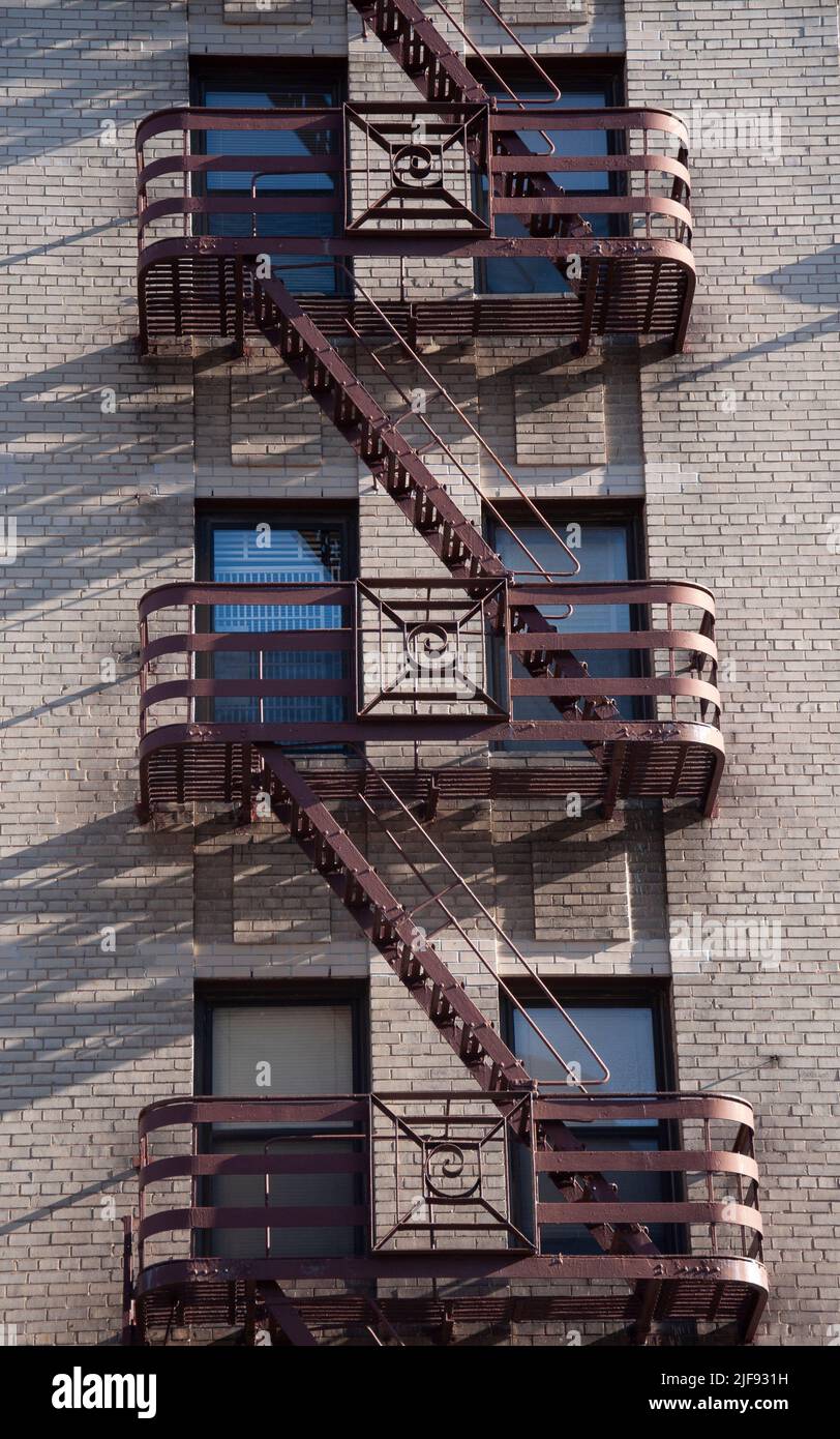 Windows and fire escapes Stock Photo - Alamy
