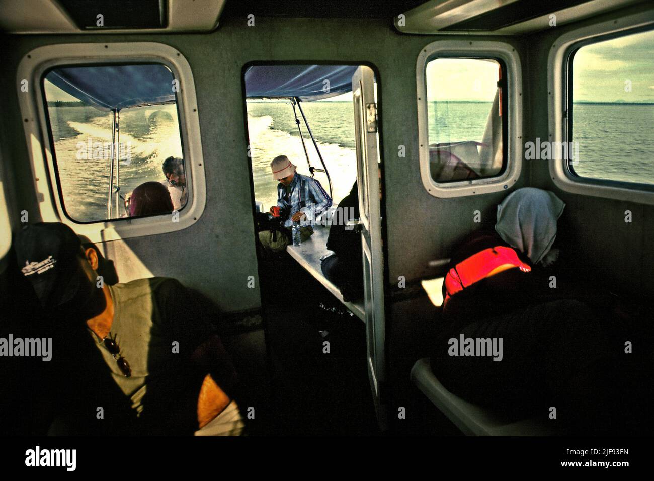 Boat passengers sleeping and having a relaxing time during a sail ...