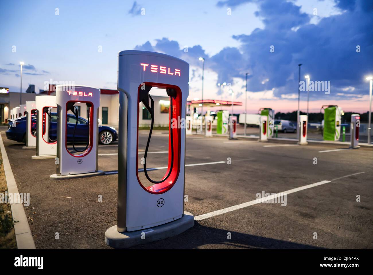 Schkeuditz, Germany. 01st July, 2022. Tesla charging stations at a car ...