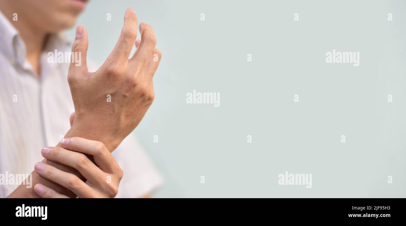 Inflammation of Asian young man wrist joint. Concept of joint pain and ...