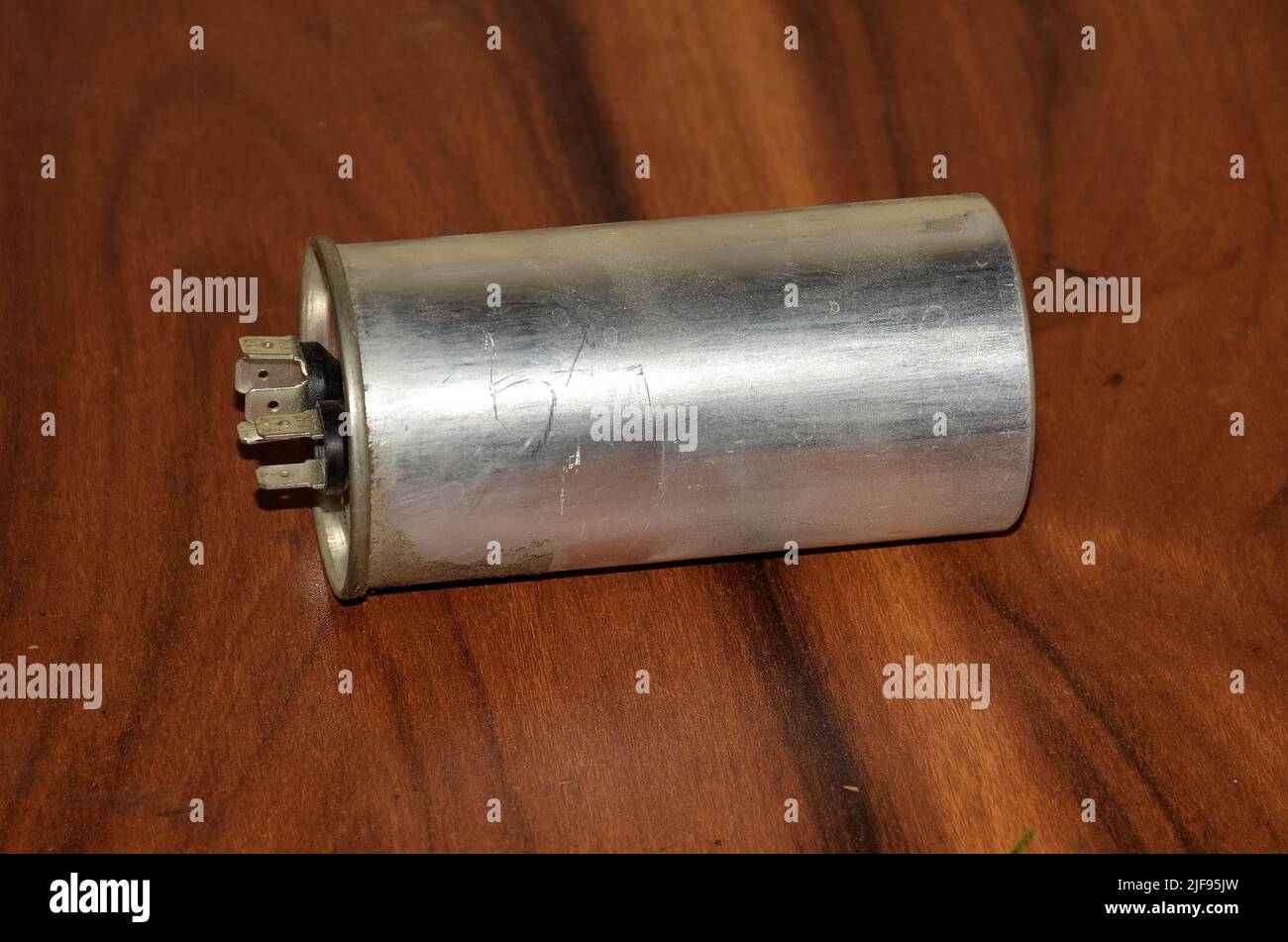 Capacitor of a window air conditioner Stock Photo - Alamy