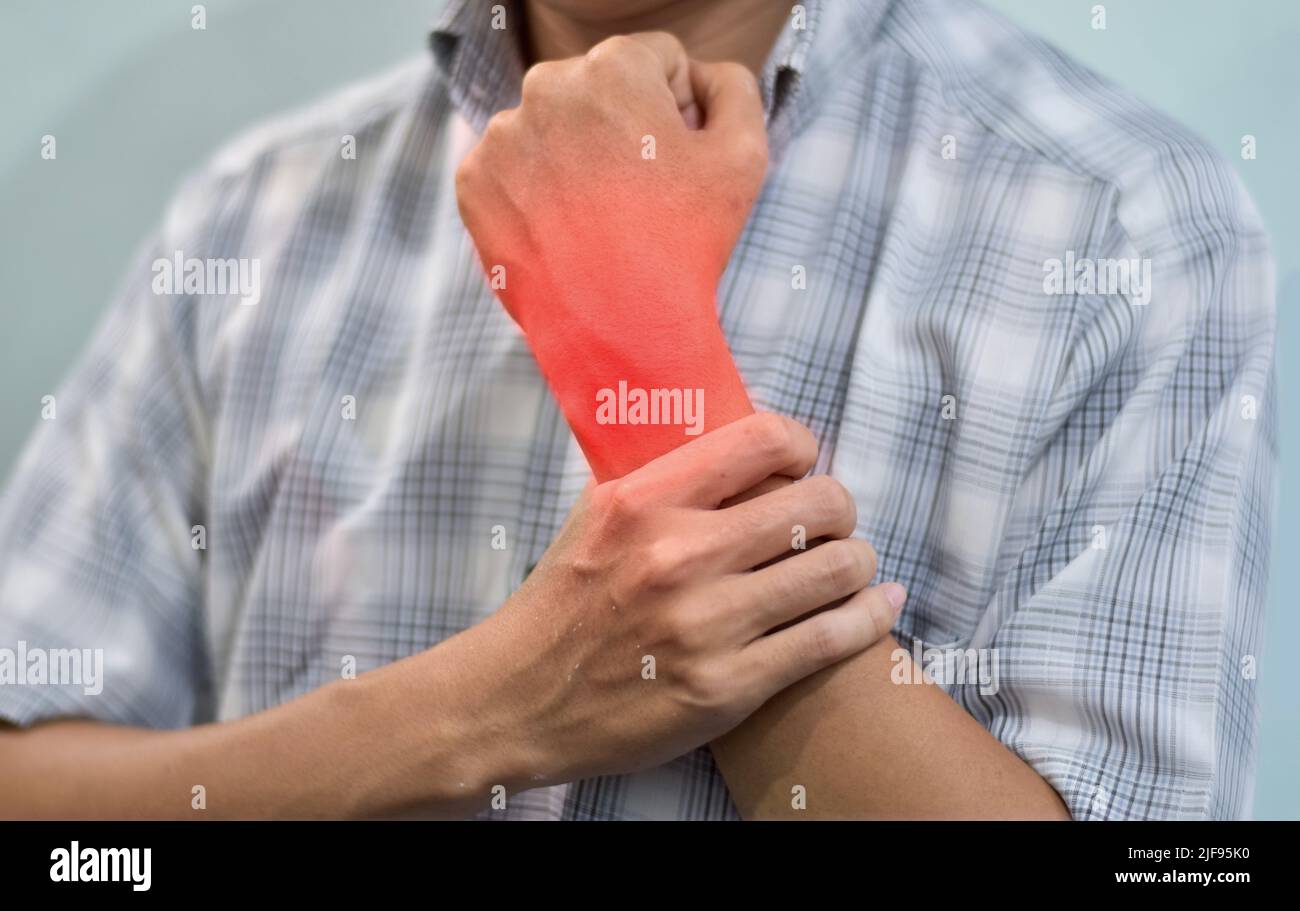 Inflammation of Asian young man wrist joint. Concept of joint pain and ...