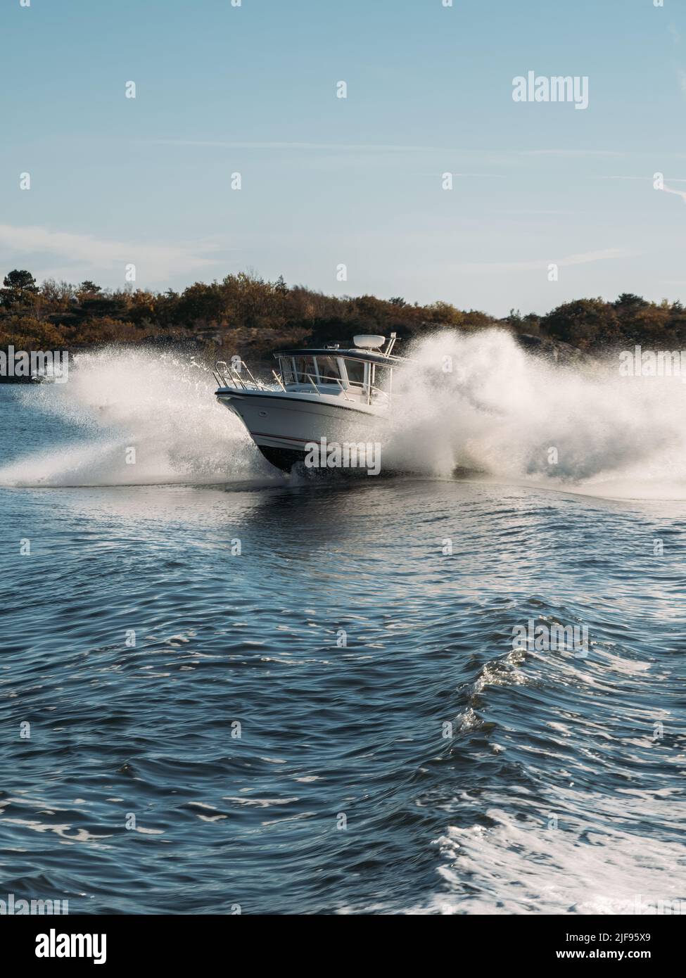 Speedboat in navigation goes on the waves in deep blue water, sea view ...