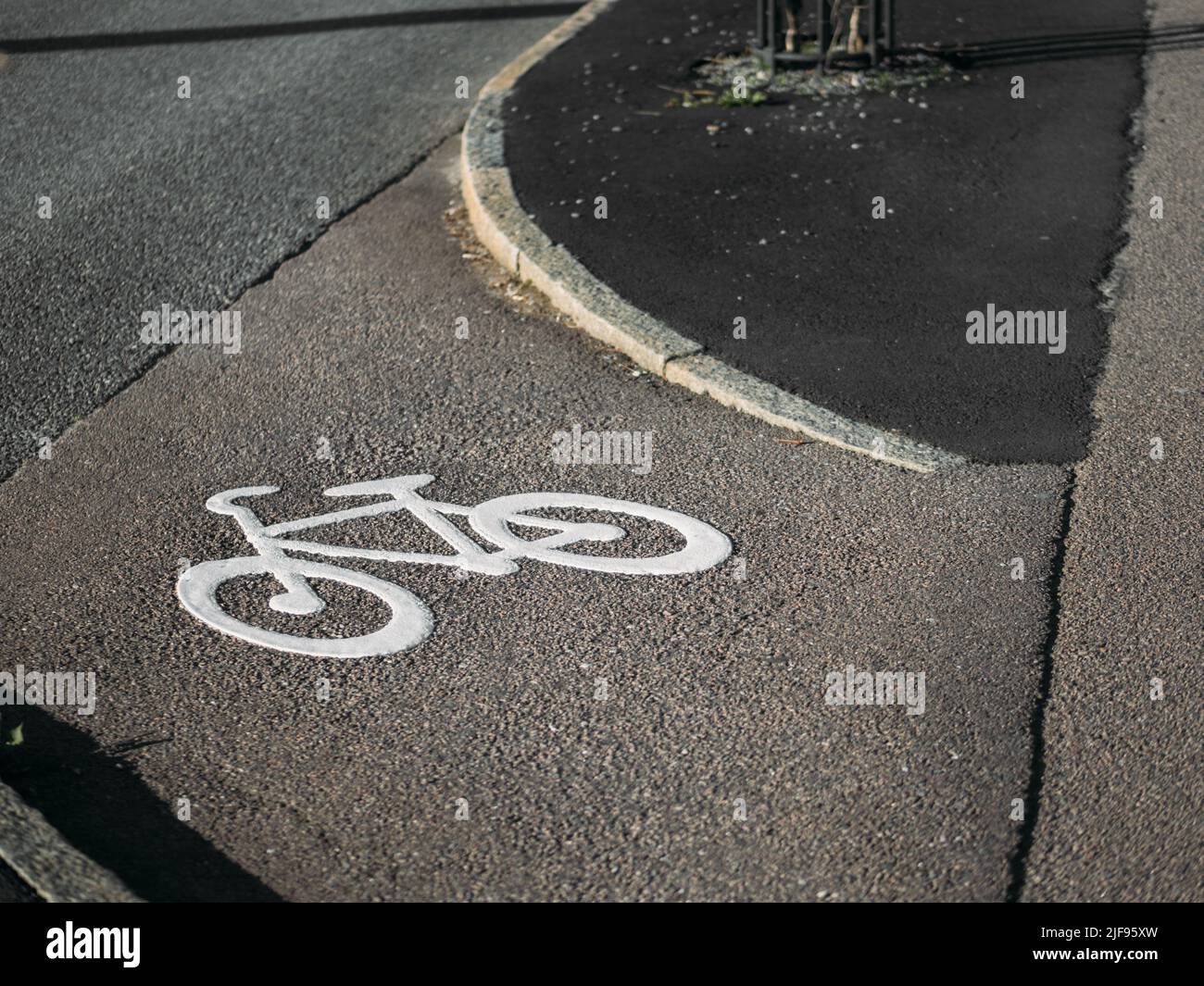 White bike path sign, lane for riding bicycles, healthy lifestyle ...