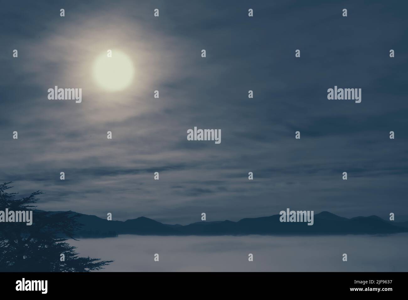 Full moon night landscape, fog in the valley Stock Photo - Alamy